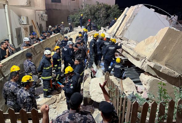 At least 10 people trapped in collapsed building in Jordan | AWANI ...