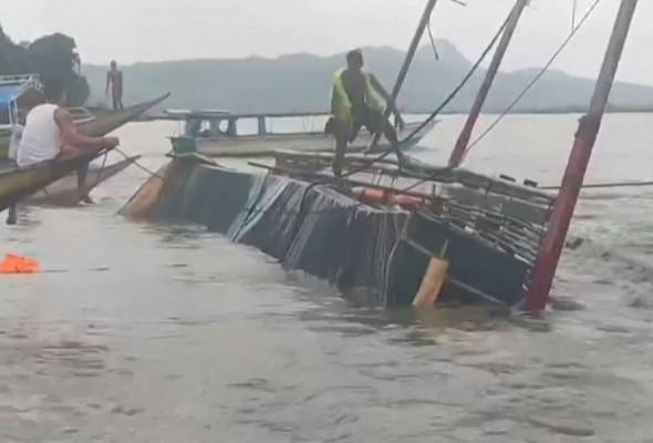 Philippines to probe sinking of overloaded boat that killed at least 26 ...