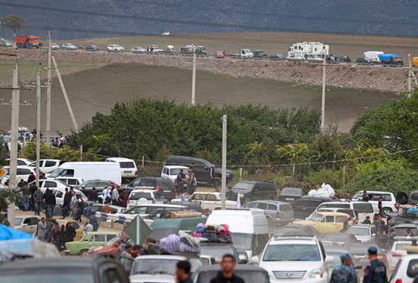 Thousands flee Karabakh to Armenia, death toll rises in fuel depot ...