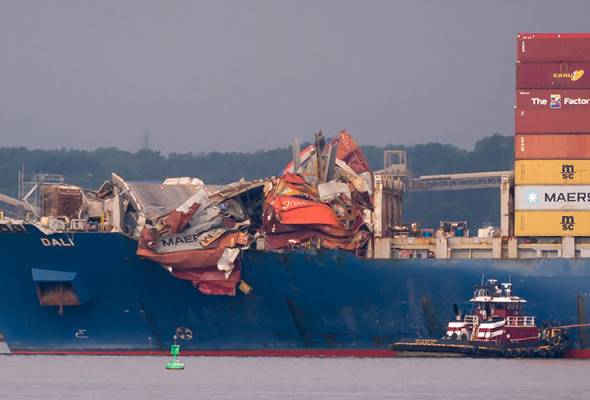 Crashed ship that took down Baltimore bridge refloated, towed from ...
